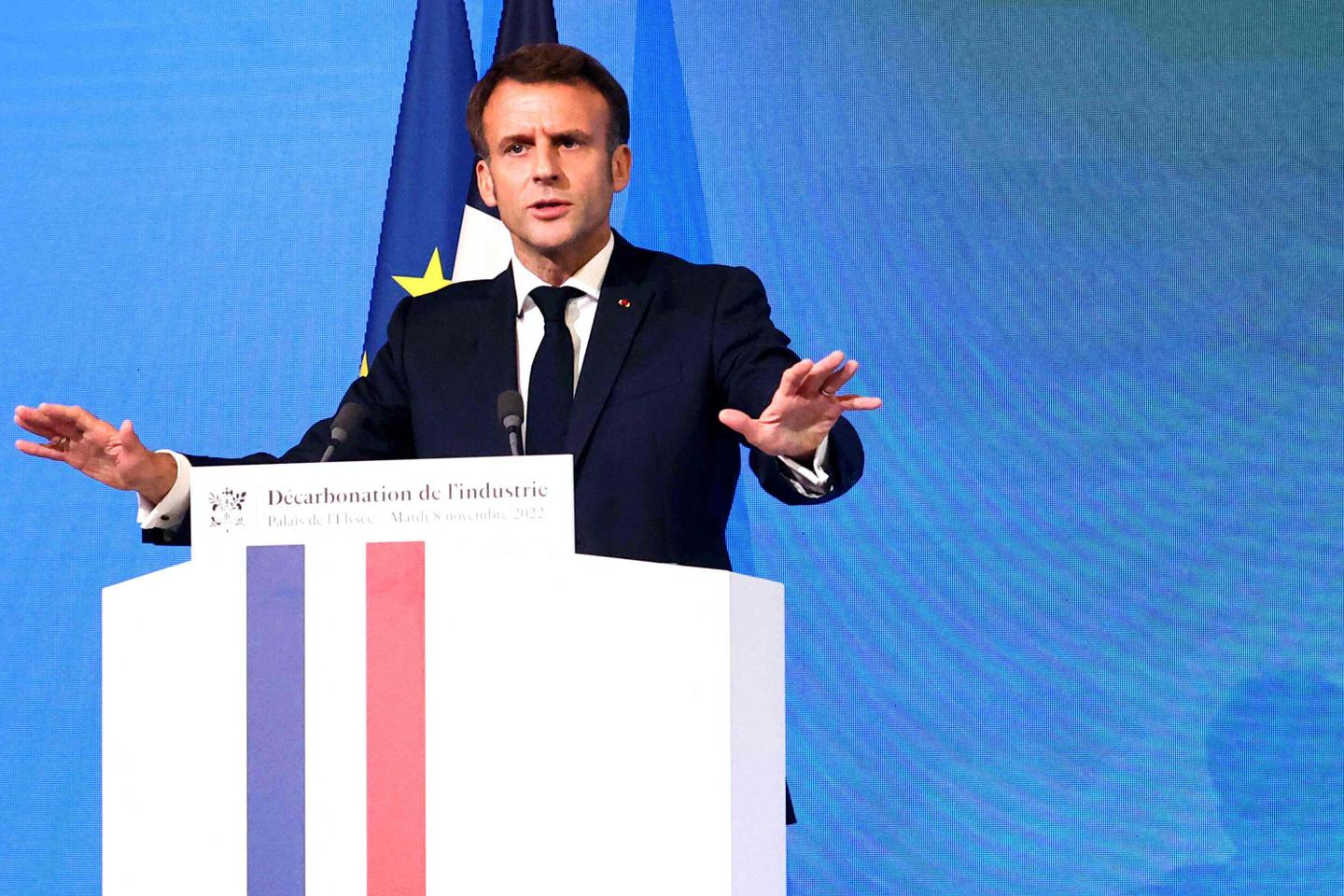 Macron urges France's big polluters to cut emissions by half