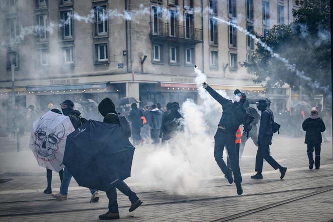 Massive turnout at French Labor Day protests marked by violent clashes