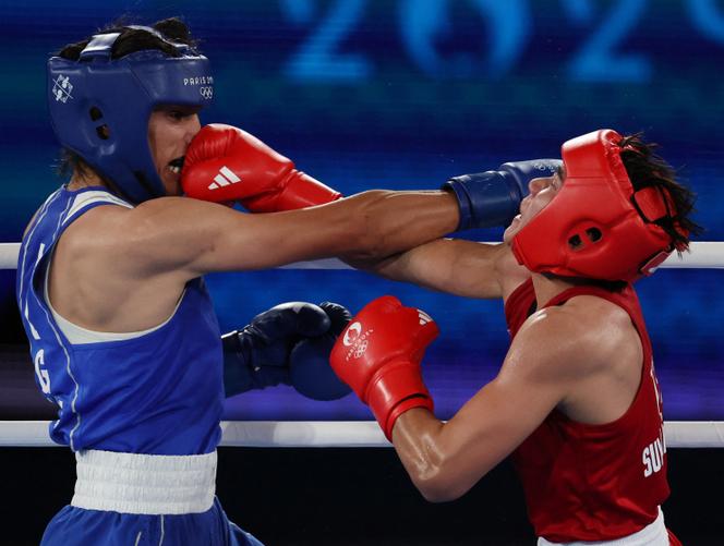 Algerian boxer Imane Khelif blocks attacks on her eligibility