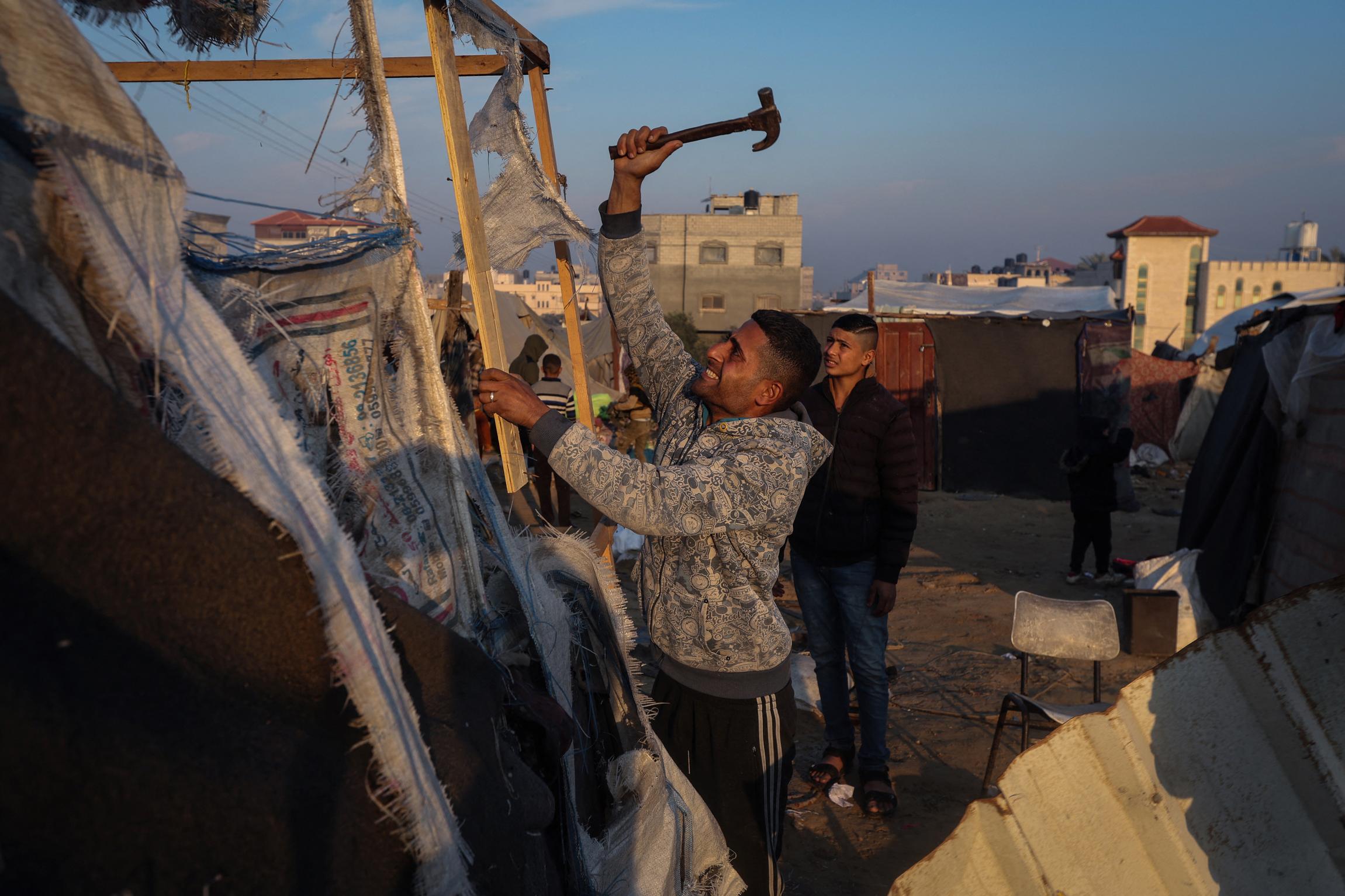 Gazans' return to a field of ruins, in pictures: 'We're all happy to be ...