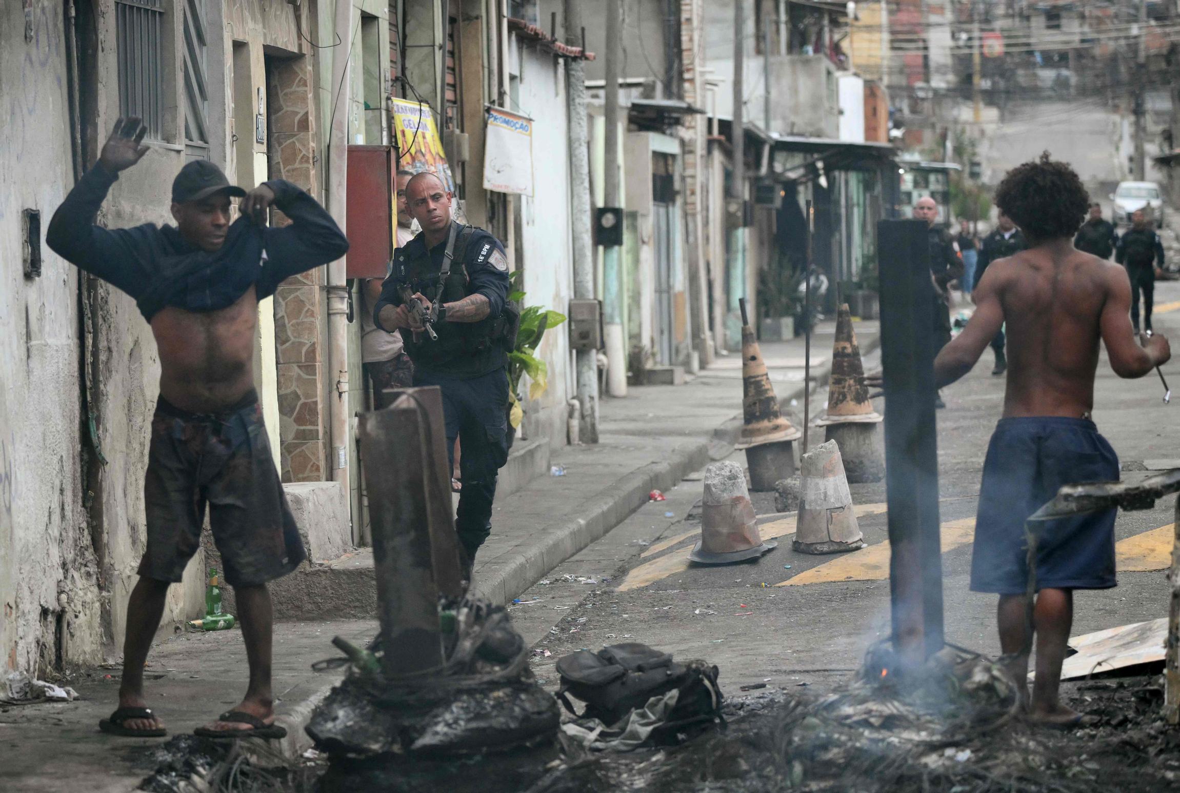Rio police raid leaves at least 64 dead in favela shootouts