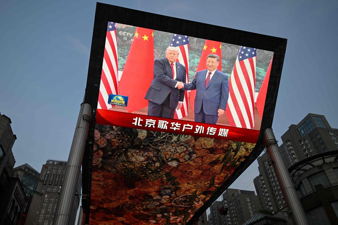 Donald Trump welcomed in Beijing with pomp and a stern warning